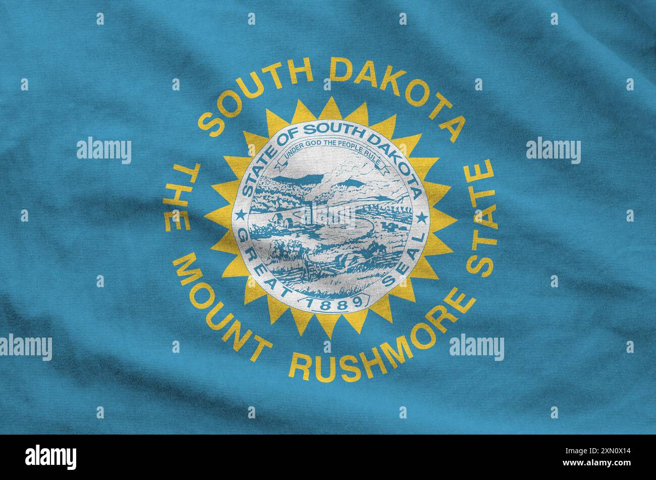 South Dakota US state flag depicted on folded wavy fabric of old cloth ...