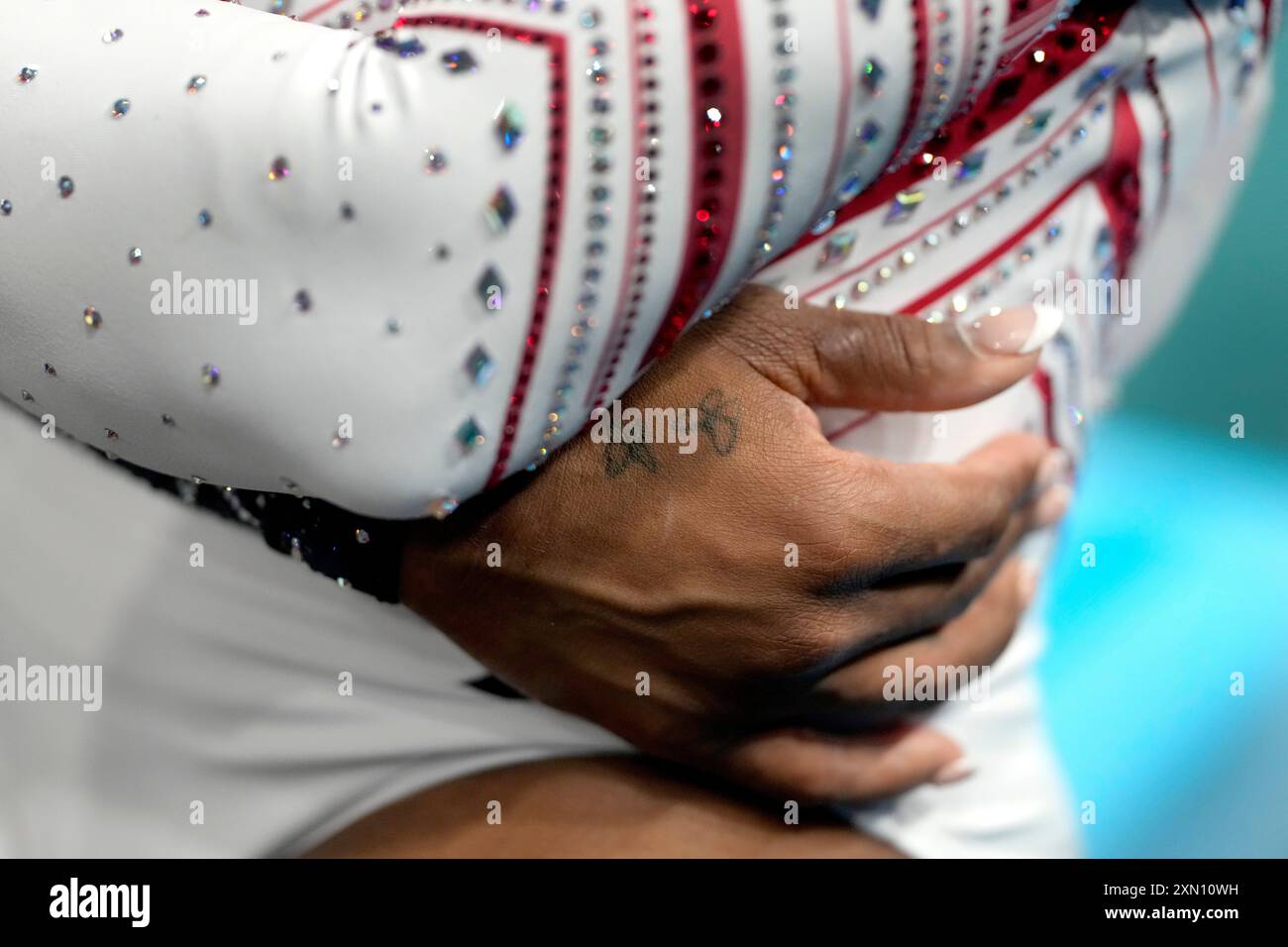 The hands of Simone Biles, of the United States, are seen during the ...