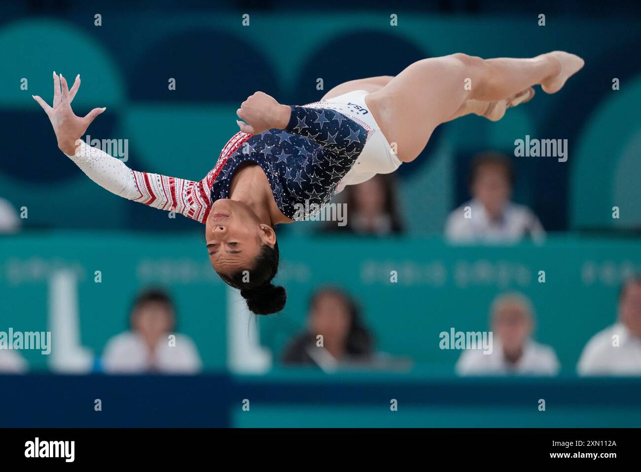 Suni Lee, of the United States, performs on the floor during the women ...