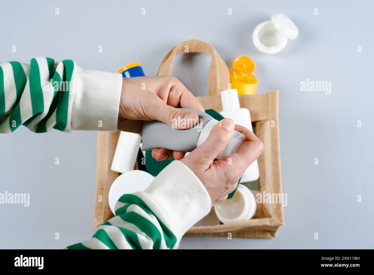 Hand sorting used cosmetic or beauty products. Responsible consumption ...