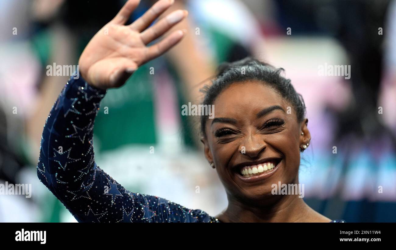 Simone Biles, of the United States, acknowledges the crowd during the ...