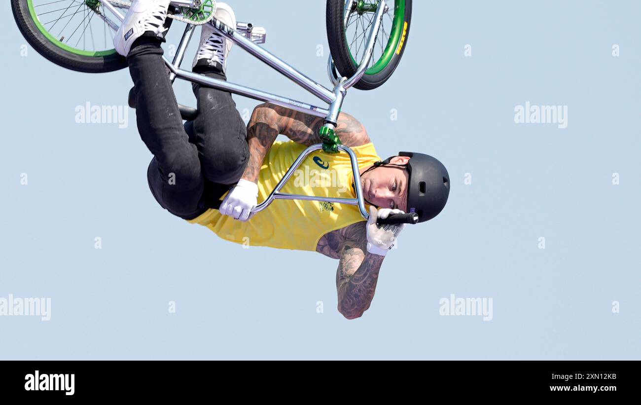 Logan Martin, of Australia, performs a trick during the cycling BMX ...