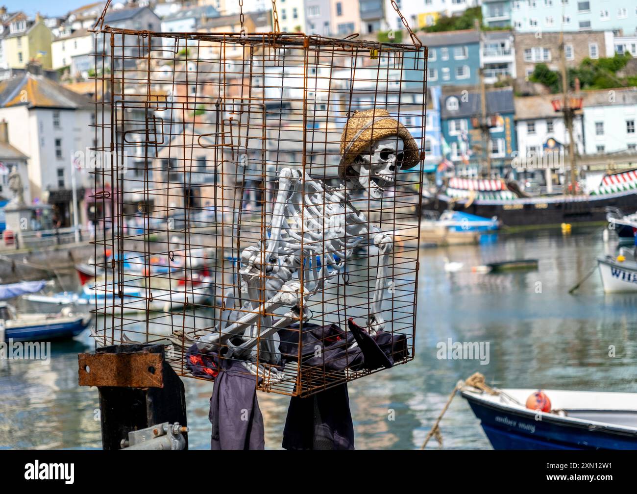 Plastic skeleton of a pirate in a metal cage on display in Brixham ...