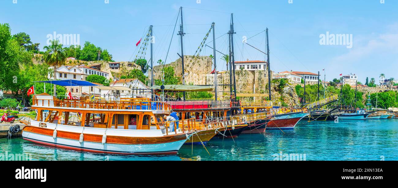 The line of moored tourist ships in old port of Kaleici, Antalya ...