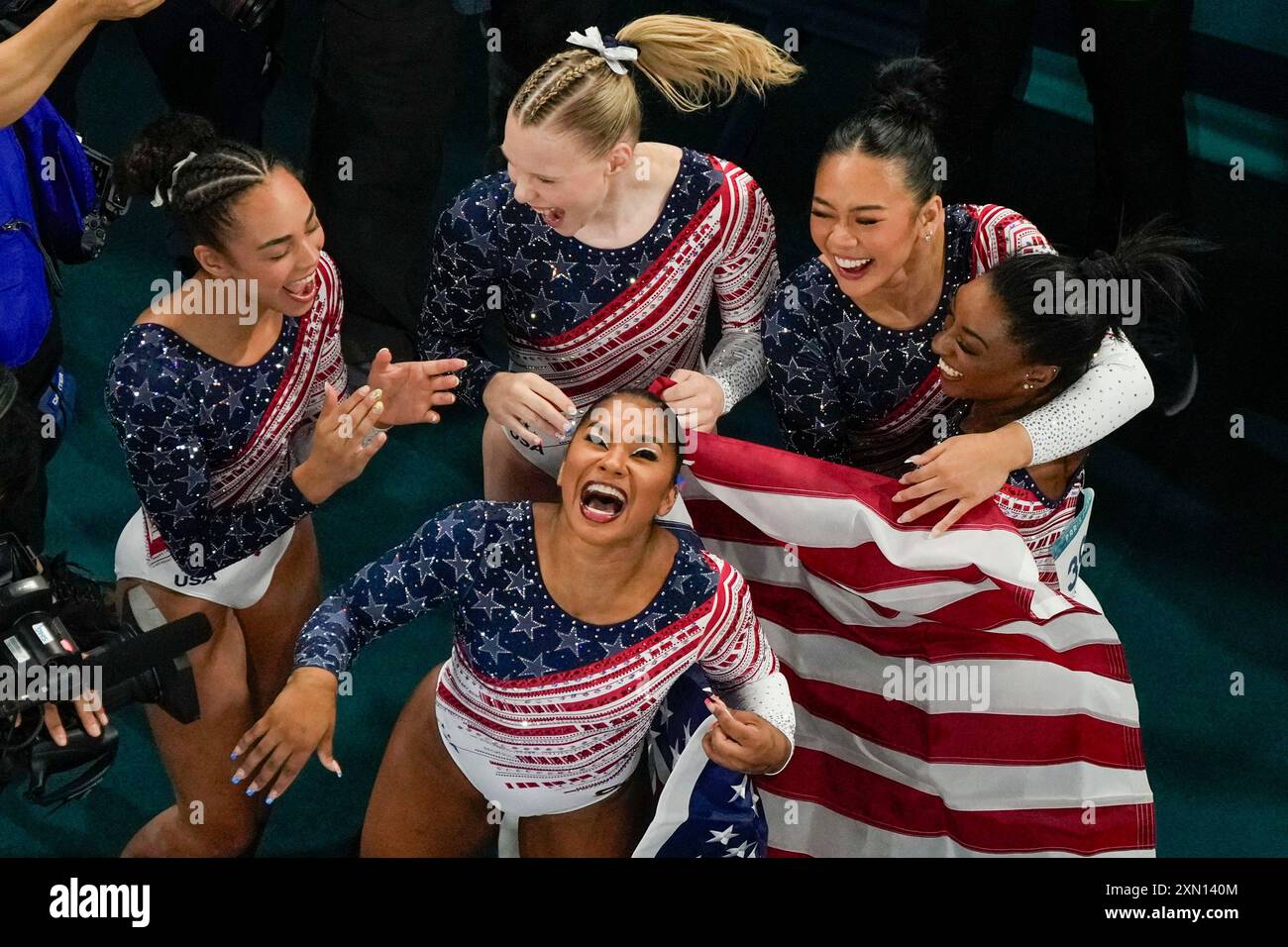 The United States women's gymnastics team celebrates after winning the ...
