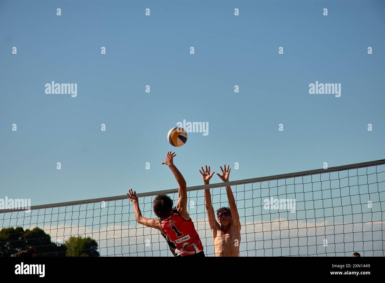 In an intense moment during the 3x3 Ladeira Beach Volleyball Tournament ...