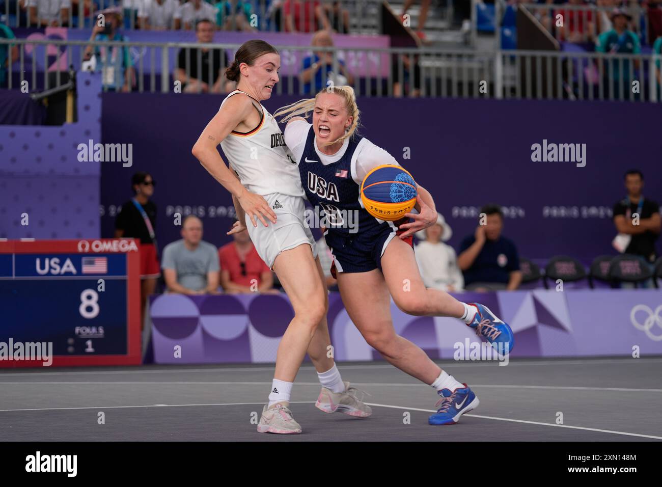 Hailey van Lith of the United States drives past Elisa Mevius of ...