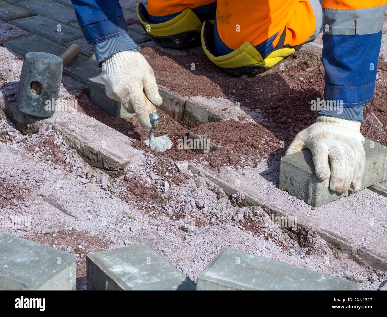 Preparation for laying new stone paving slabs to replace the damaged ...