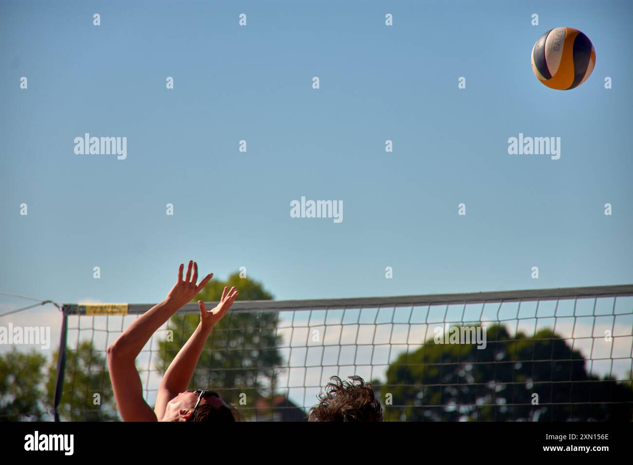In an intense moment during the 3x3 Ladeira Beach Volleyball Tournament ...