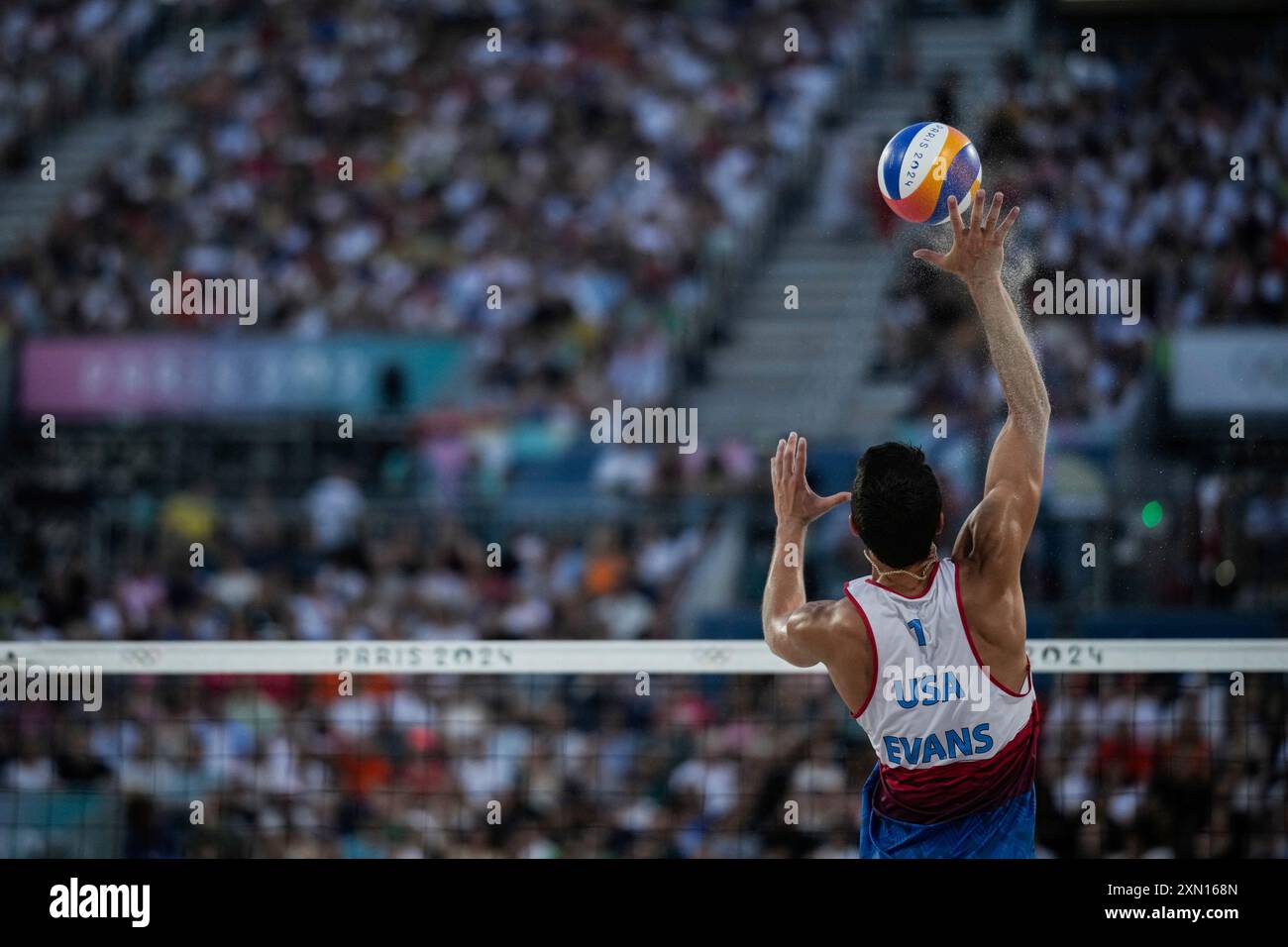 US' Miles Evans reaches the ball during the men's pool F beach ...