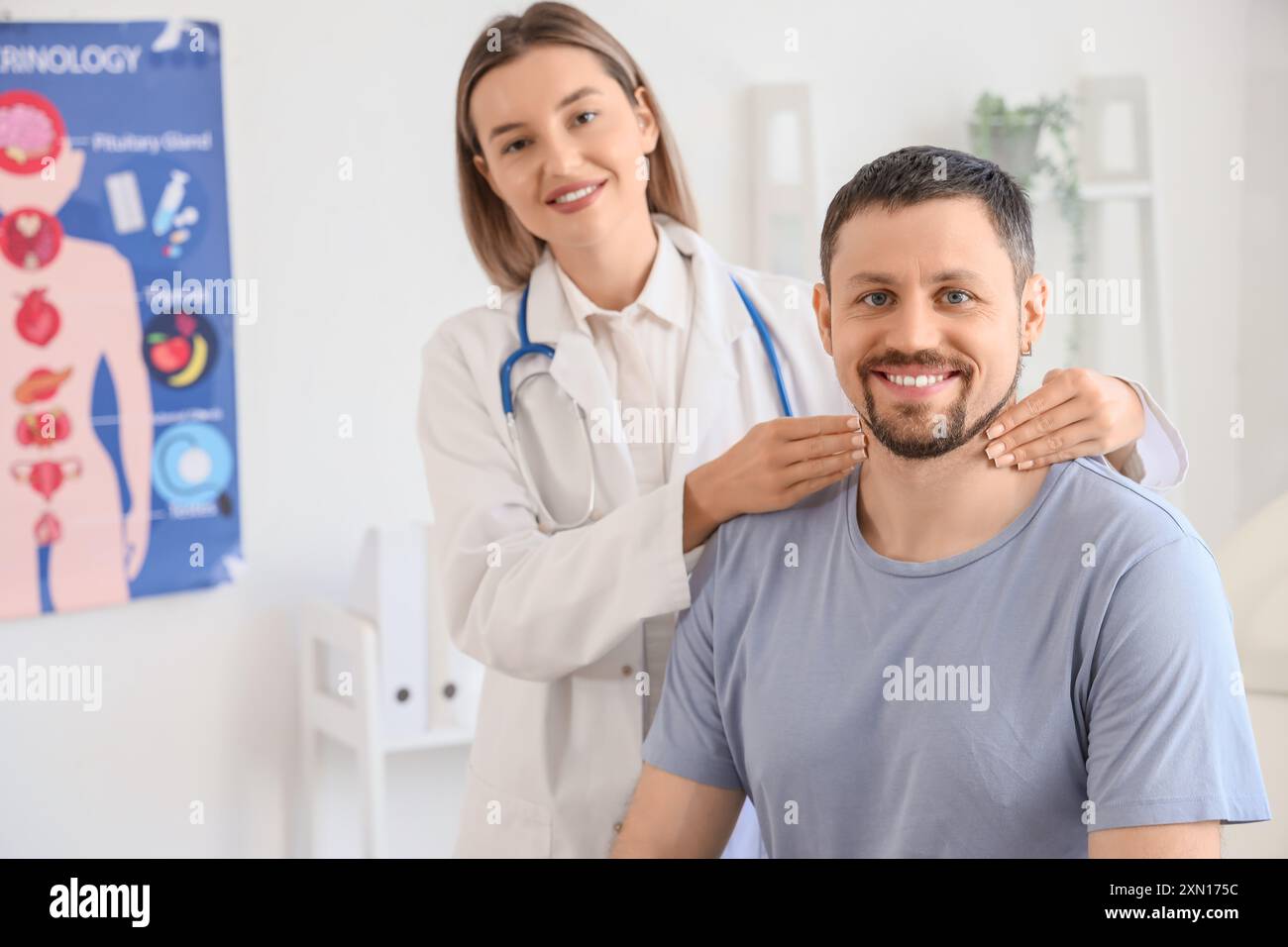 Female endocrinologist examining thyroid gland of man in clinic Stock ...