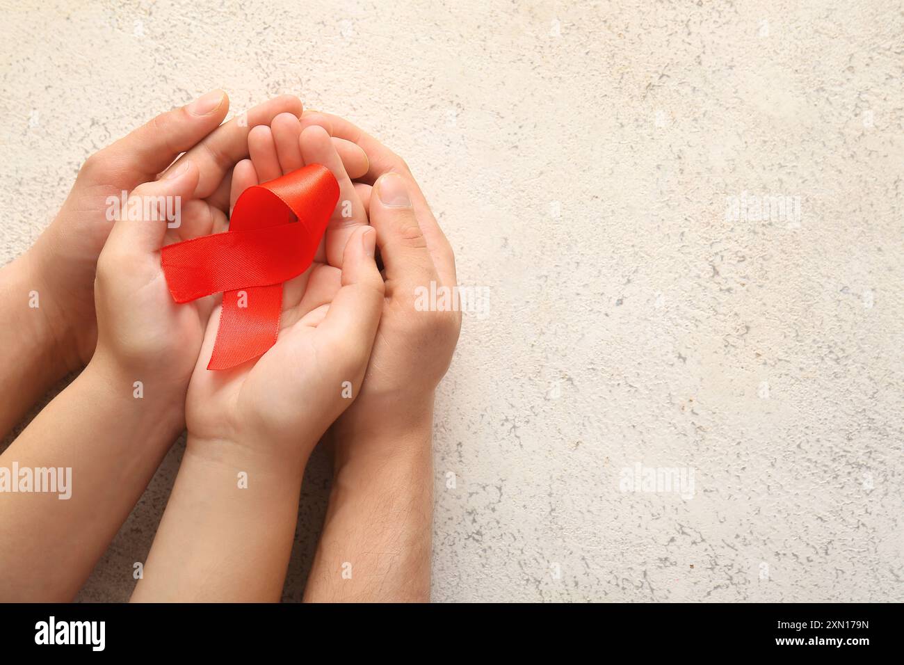 Hands with red ribbon on grunge white background. Blood Cancer ...