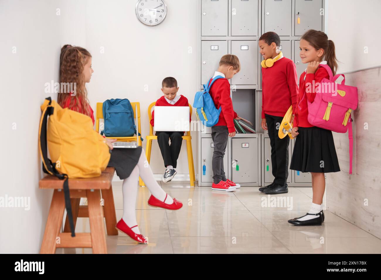Little pupils at school hall Stock Photo - Alamy