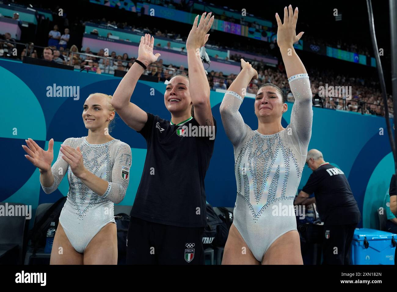 Members of Team Italy celebrate after winning the silver medal in the ...