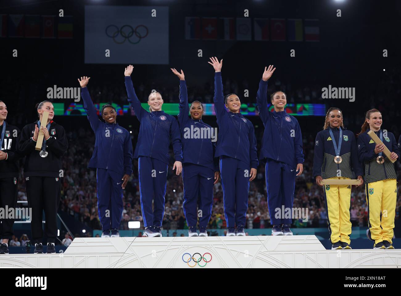 Paris, France. 30th July, 2024. Gold medalists team USA wave to the ...