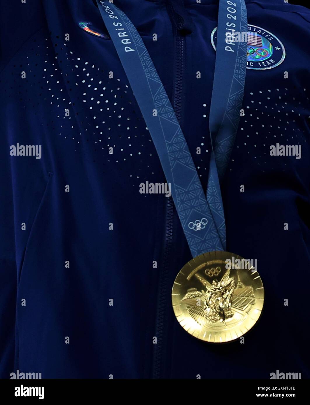 Paris, France. 30th July, 2024. A gold medalist of team USA wears her ...