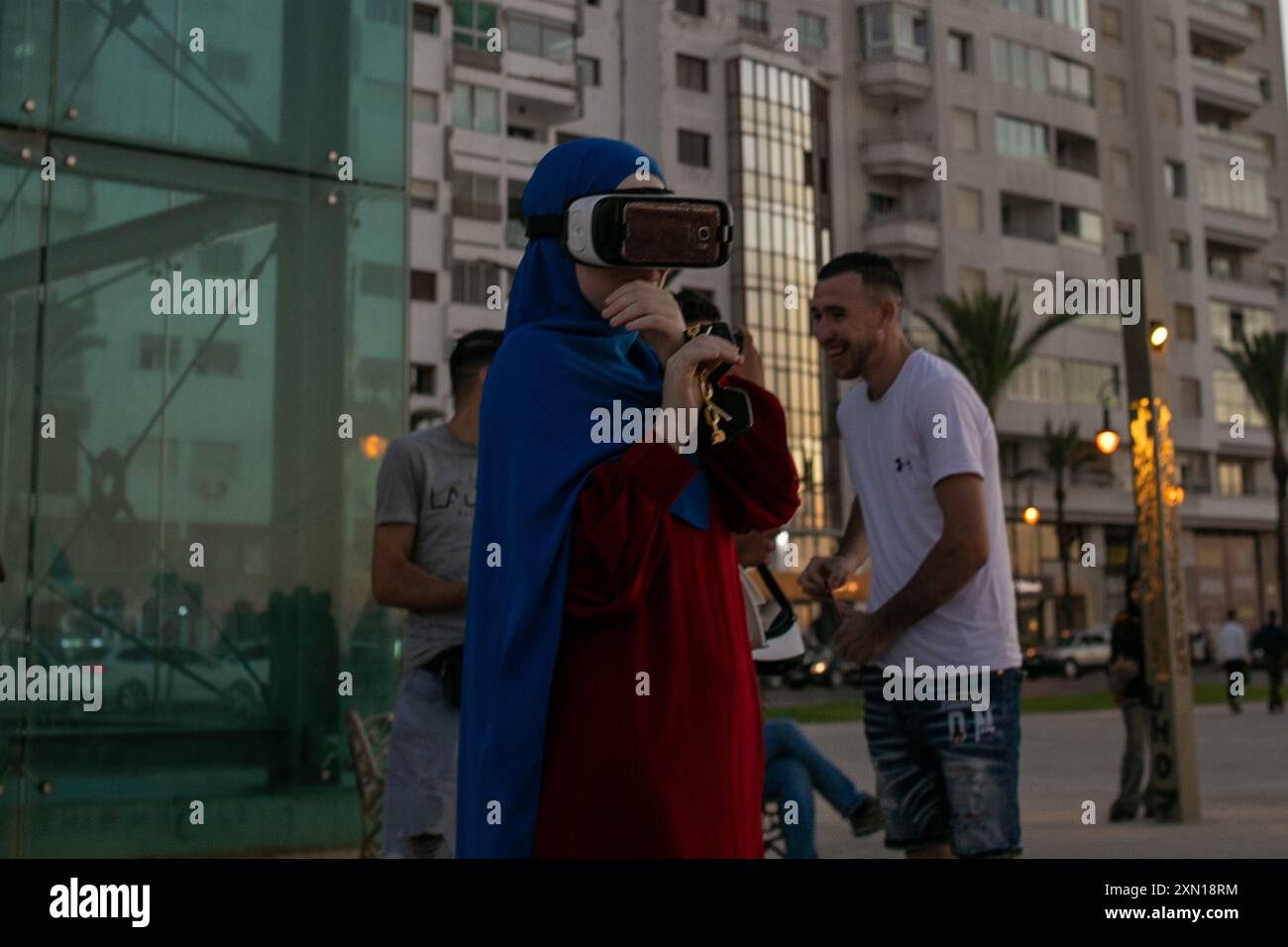 Tangier, Morocco. 27th July, 2024. A woman wears augmented reality ...