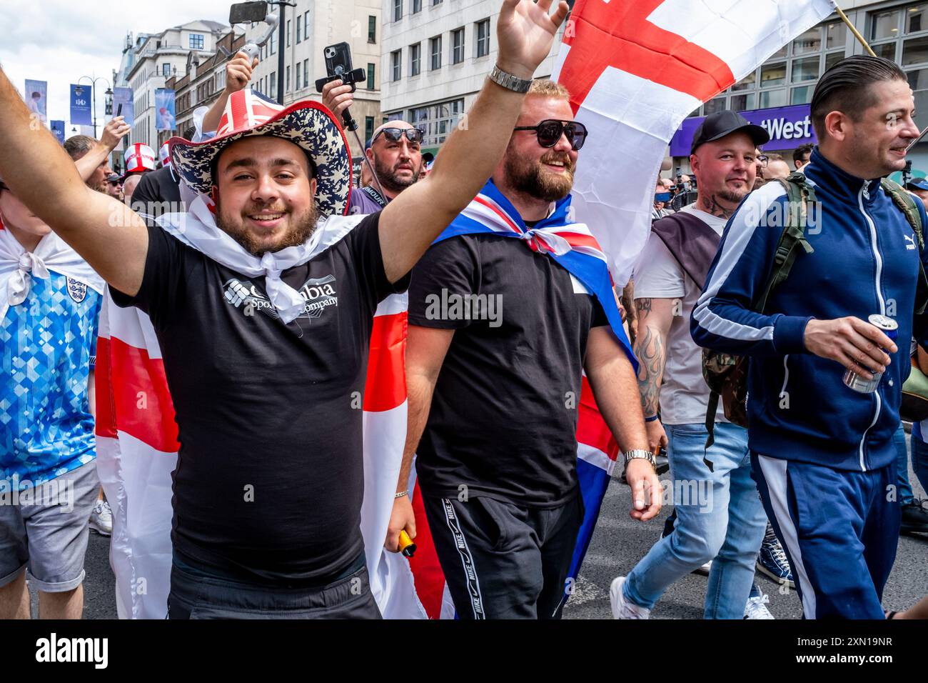 A Group Of Young British People Marching On The July 27th 'Uniting The ...