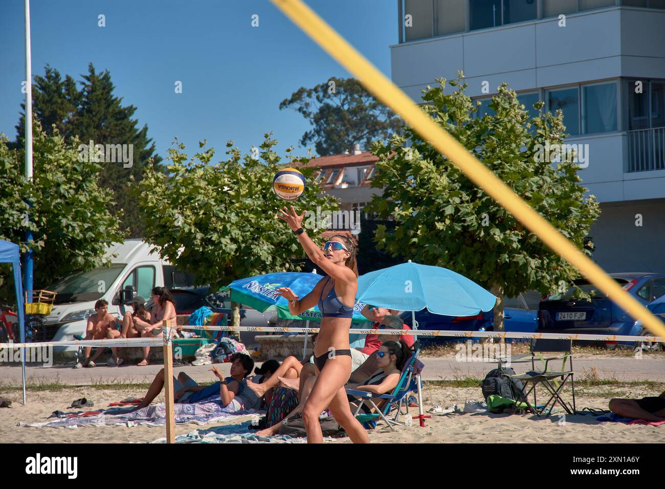 A pivotal moment in the 3x3 Ladeira Beach Volleyball Tournament in Baiona captures a player ...