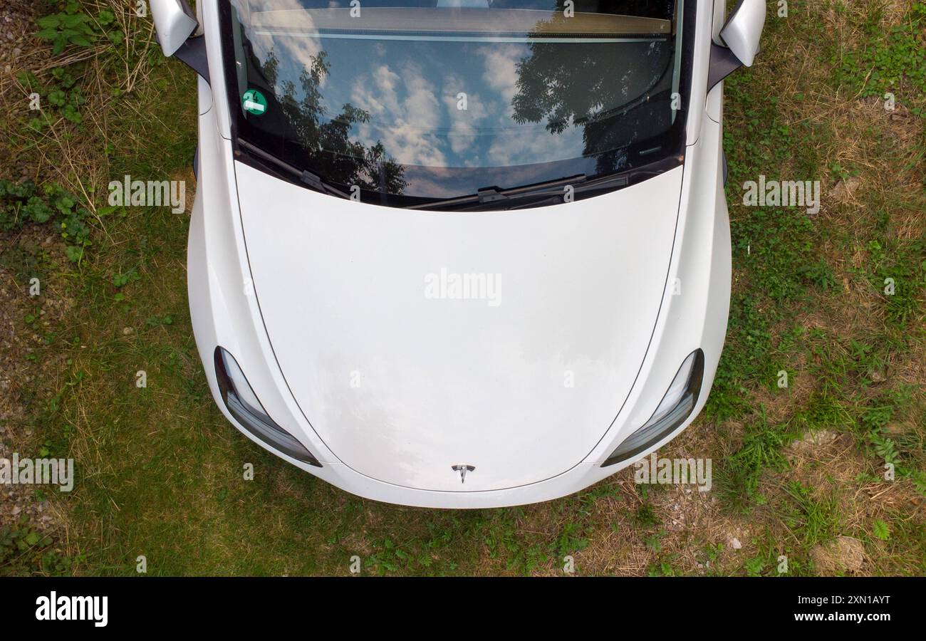 Bavaria, Germany - July 27, 2024: Aerial view shows a white Tesla Model ...