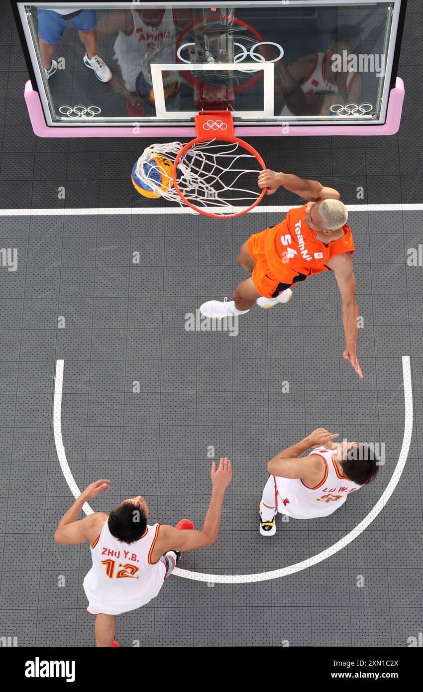 Paris, France. 30th July, 2024. Team China and team the Netherlands dunks during the 3x3 ...