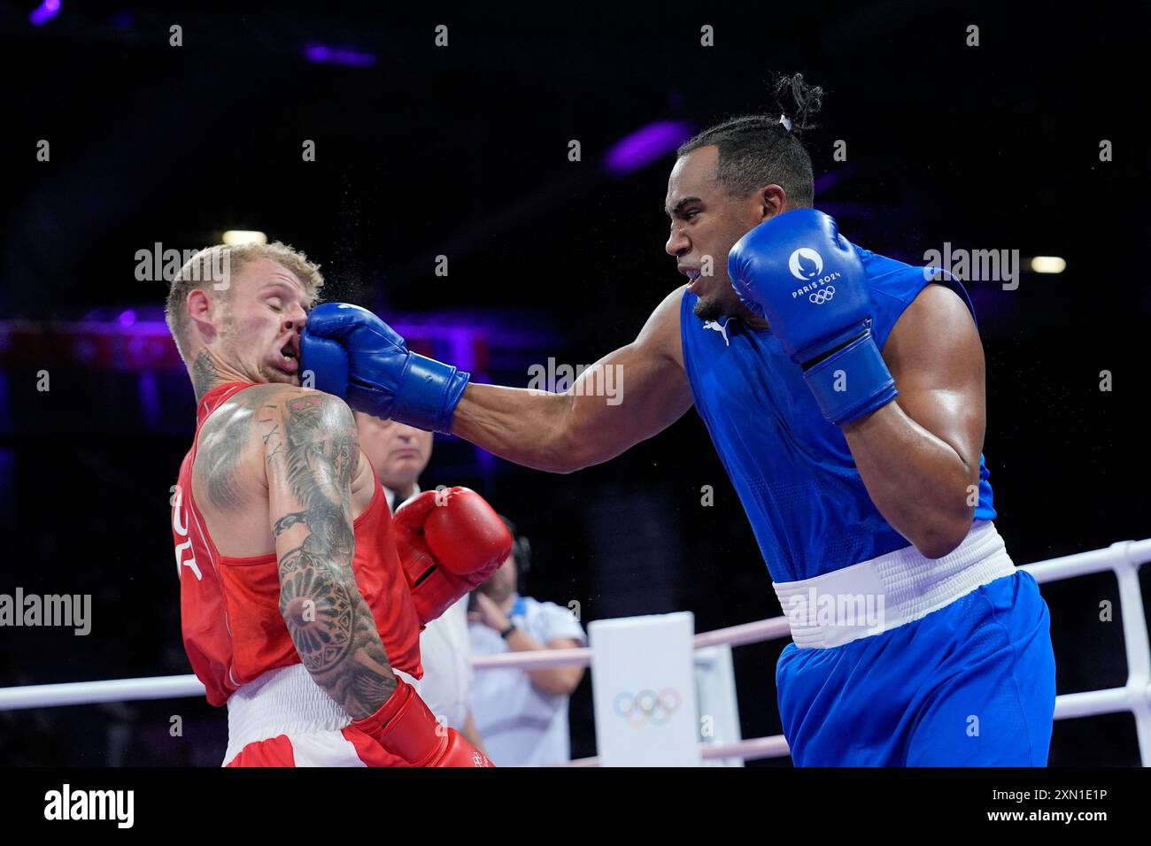 Turkey's Kaan Aykutsun, left, fights Cuba's Arlen Lopez in their ...