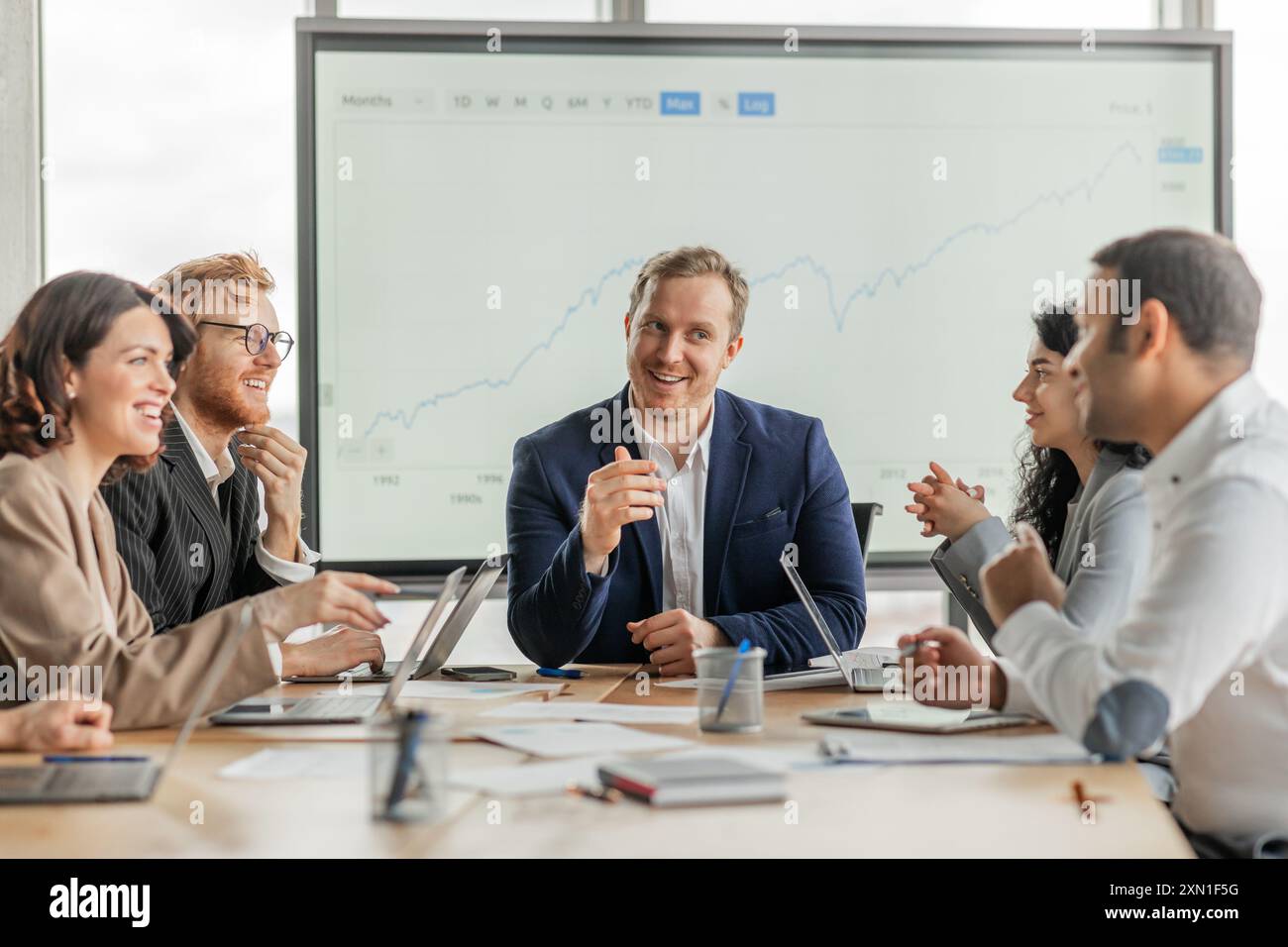 Business Professionals Collaborating Around a Conference Table During a ...