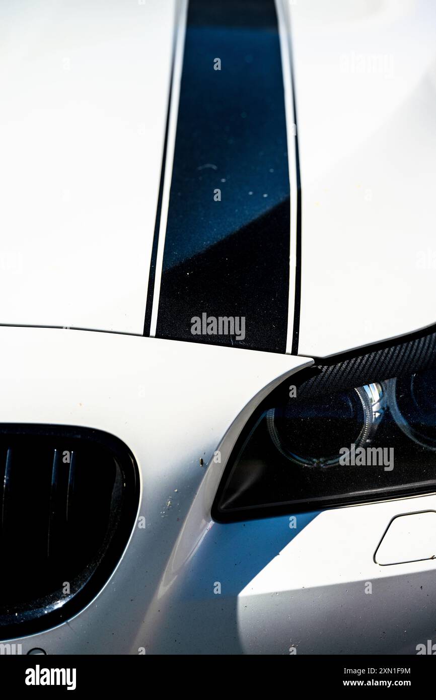 Black racing stripes on the hood of a white car Stock Photo - Alamy