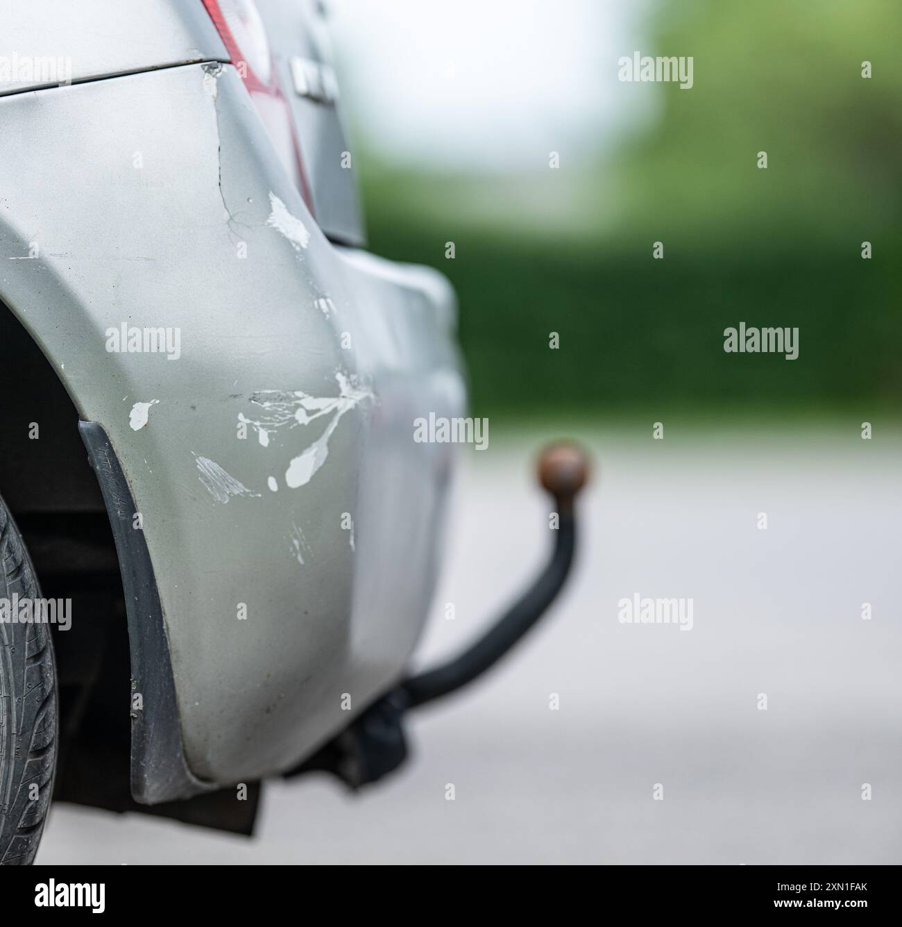Damaged rear bumper of a silver compact car with tow bar Stock Photo ...