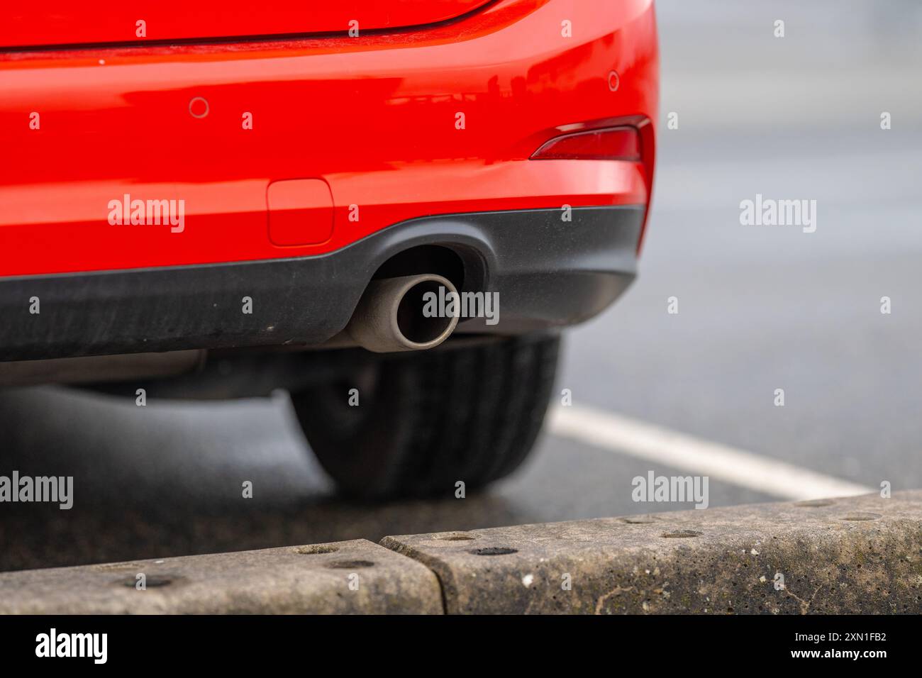Rear bumper of a red car Stock Photo - Alamy