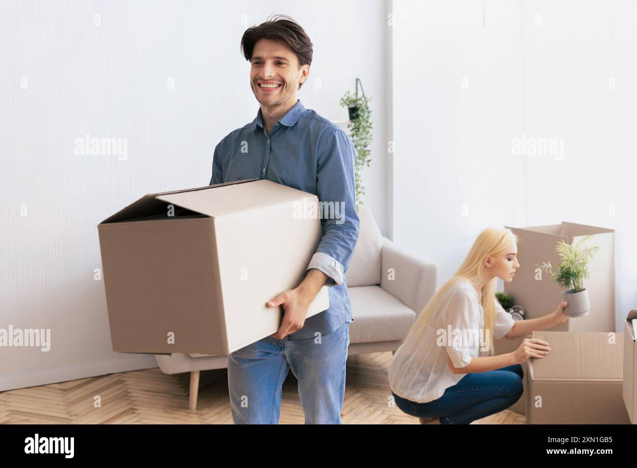 Woman packing boxes during move hi-res stock photography and images - Alamy