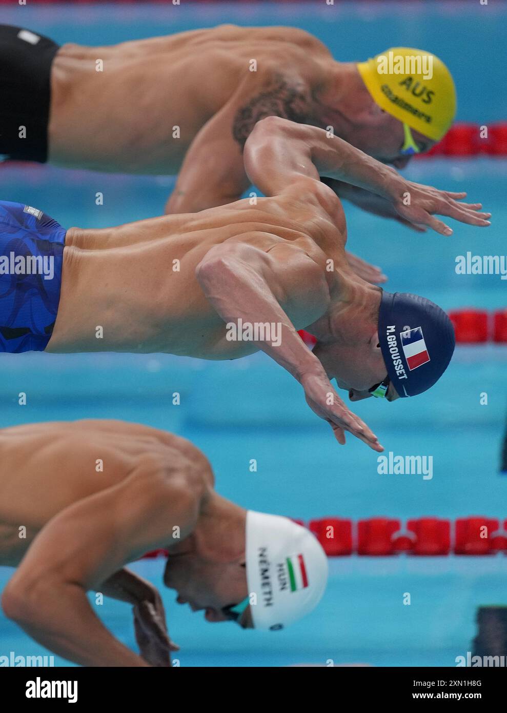 Paris, France. 30th July, 2024. Maxime Grousset (C) of France dives ...