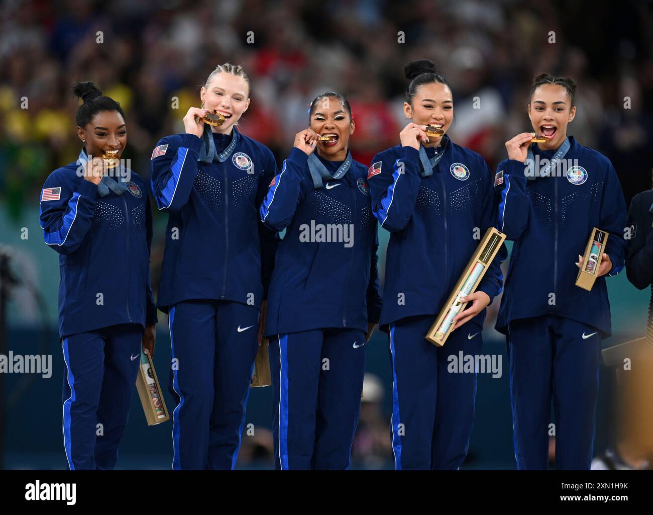 Members of the United States pose for cameras during a medal ceremony ...