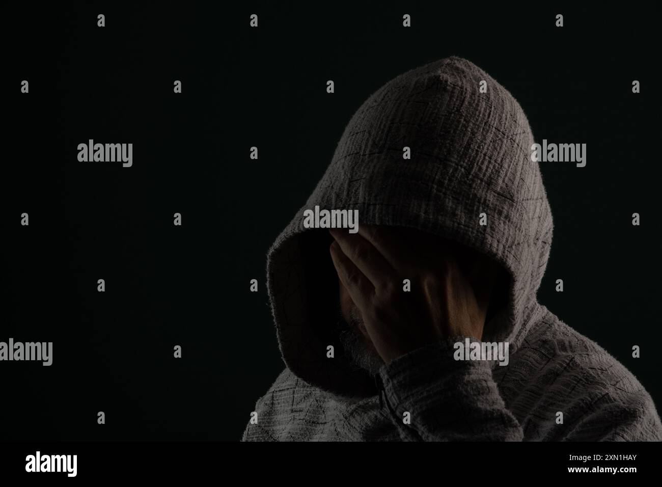 Dangerous face hooded hacker man hi-res stock photography and images ...