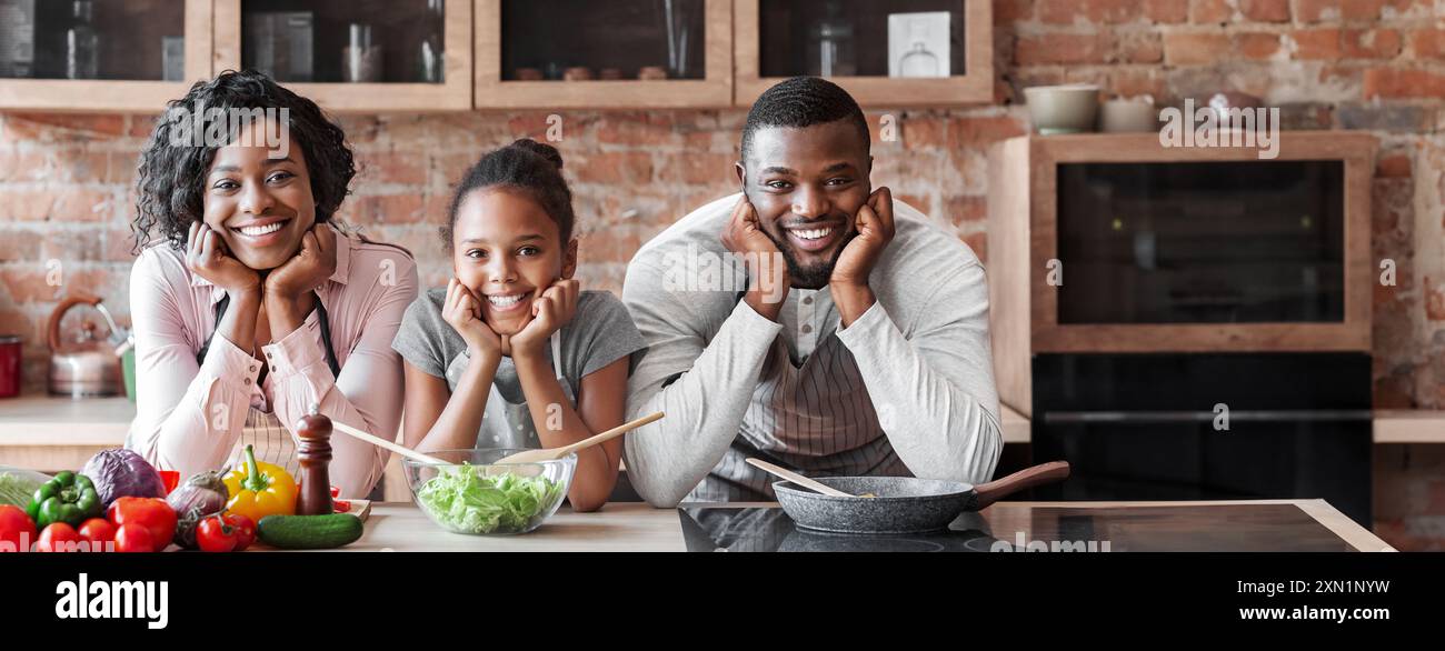 Beautiful african american family making dinner together Stock Photo ...