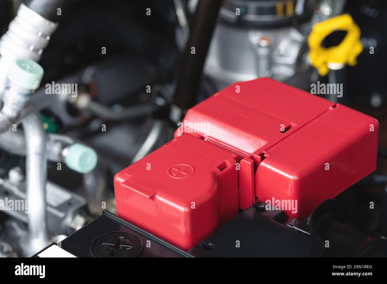 Car battery terminal connection close up view on engine background ...