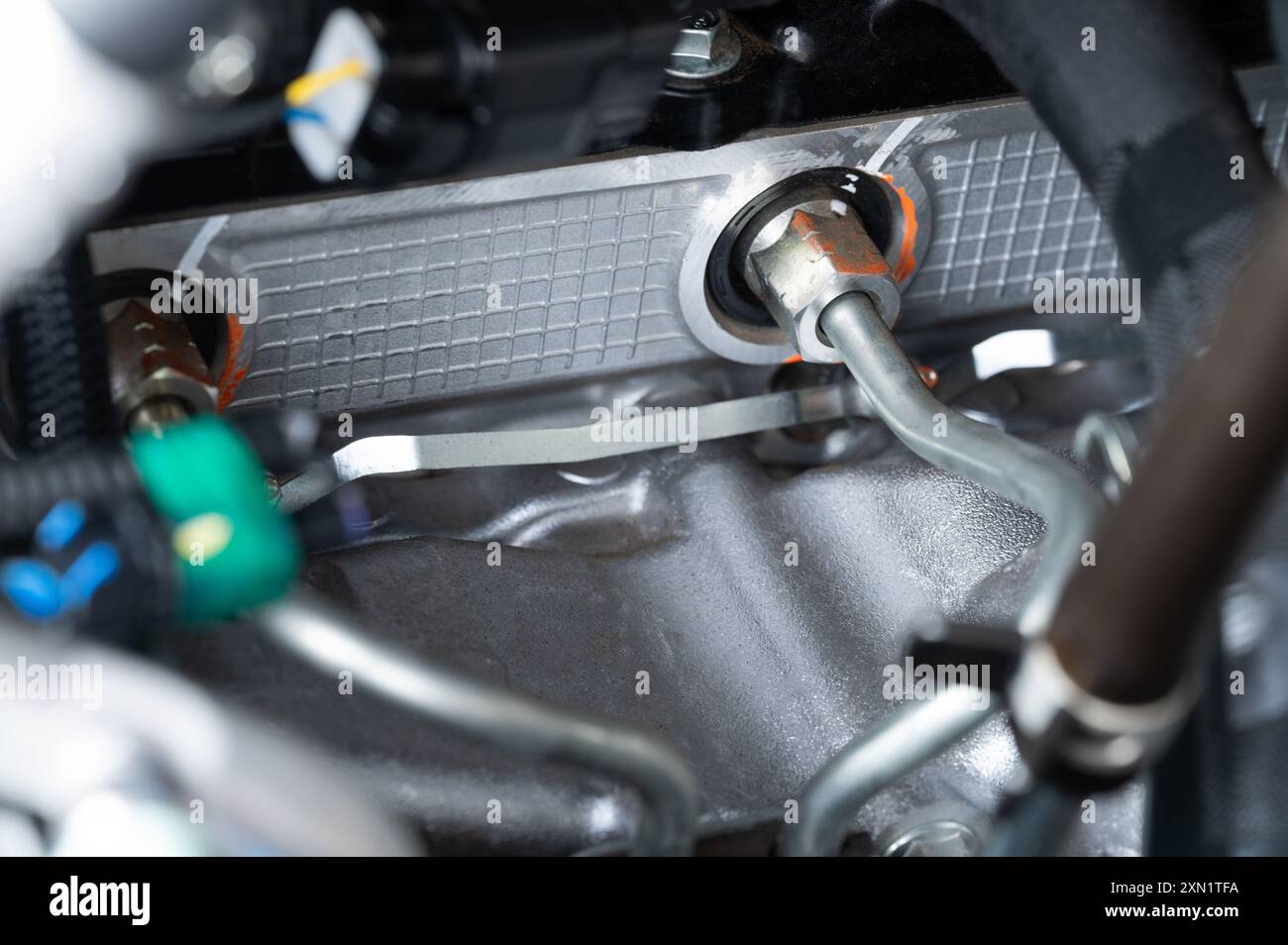 Engine metal injectors pipe connection close up view Stock Photo - Alamy