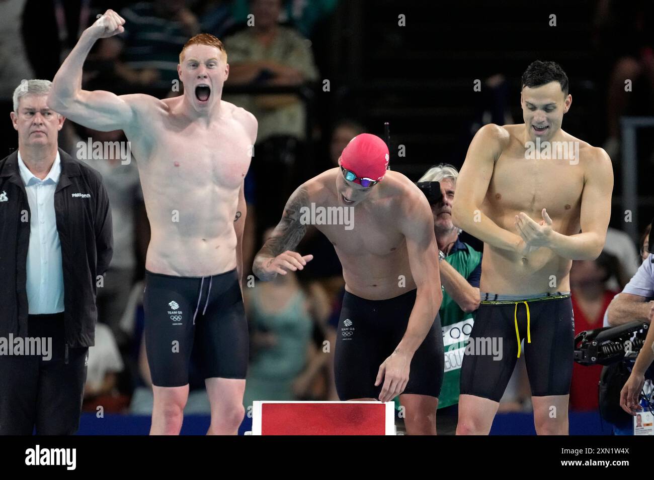 Britain's men's 4x200-meter freestyle relay team celebrate after ...