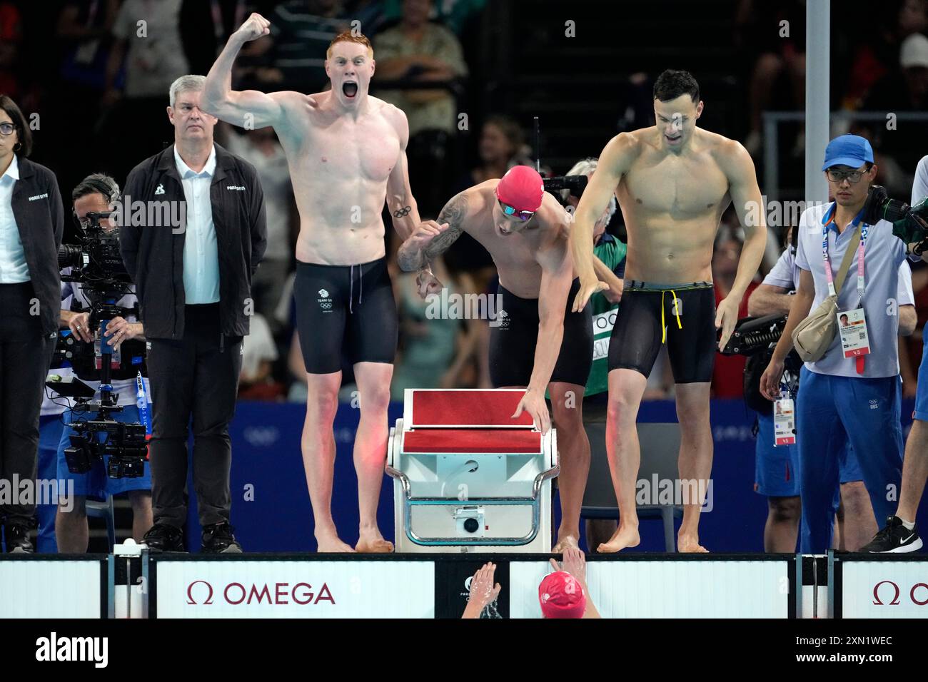 Britain's men's 4x200-meter freestyle relay team celebrate after ...