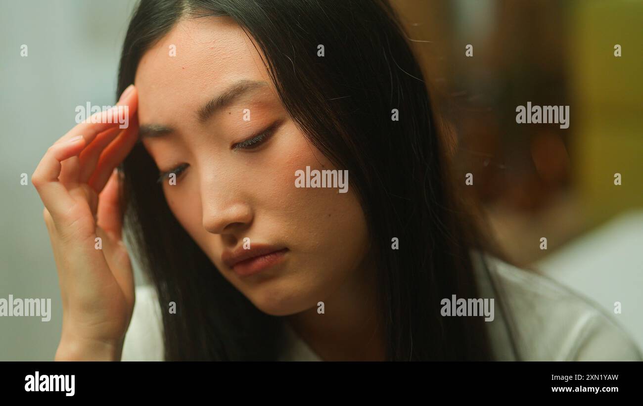 Sad distressed asian girl hi-res stock photography and images - Alamy