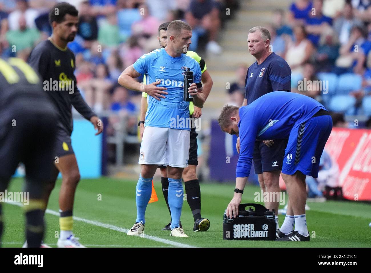 Coventry City's Jake Bidwell and manager Mark Robins (right) during the ...