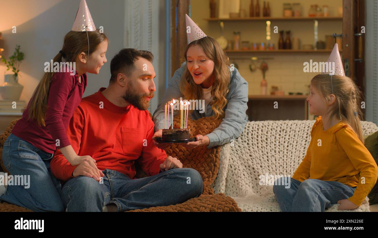 Happy birthday event Caucasian family mom children congratulate dad ...