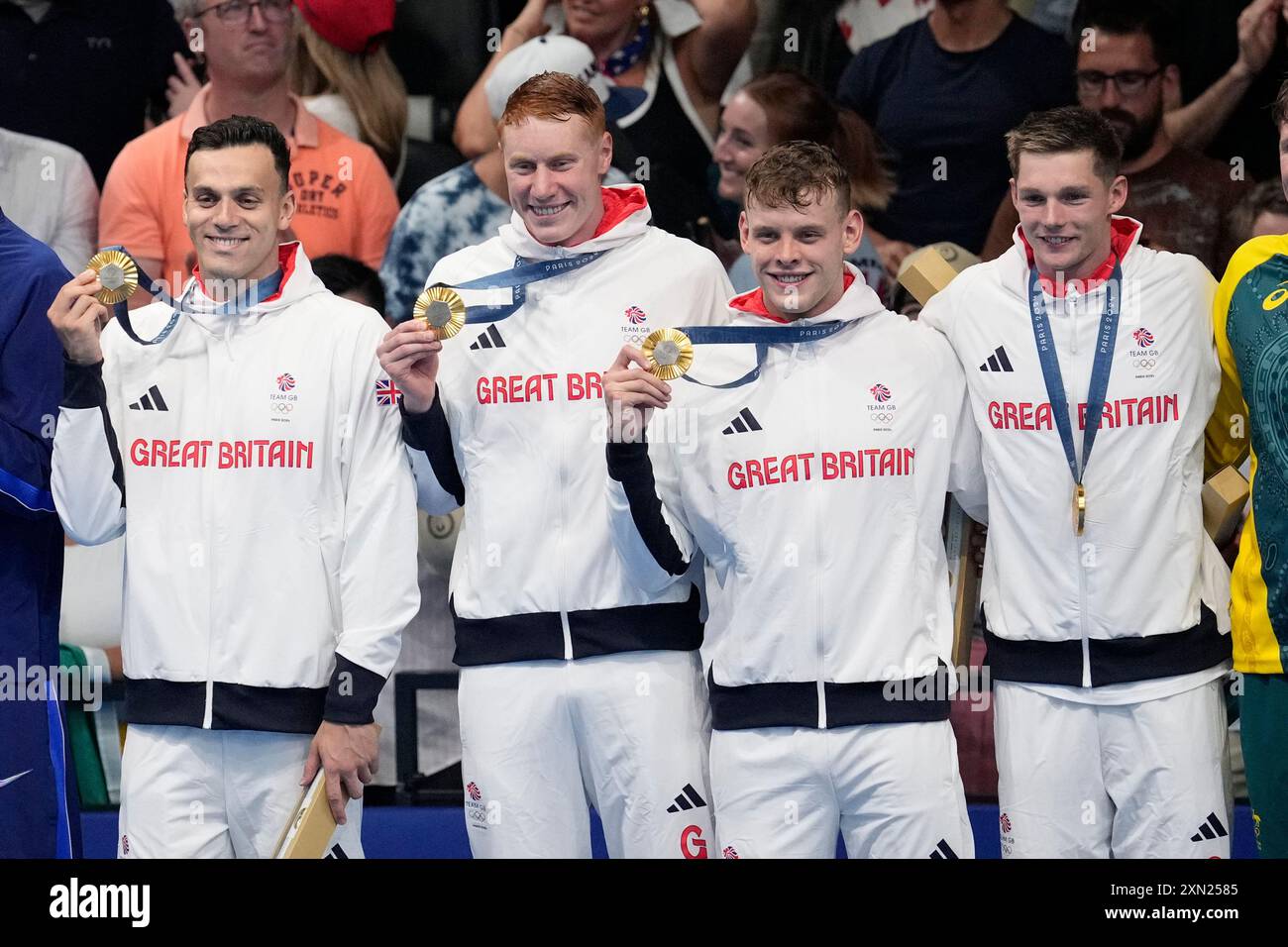 Britain s Gold Medal Men s 4x200 meter Freestyle Relay Team Stands On