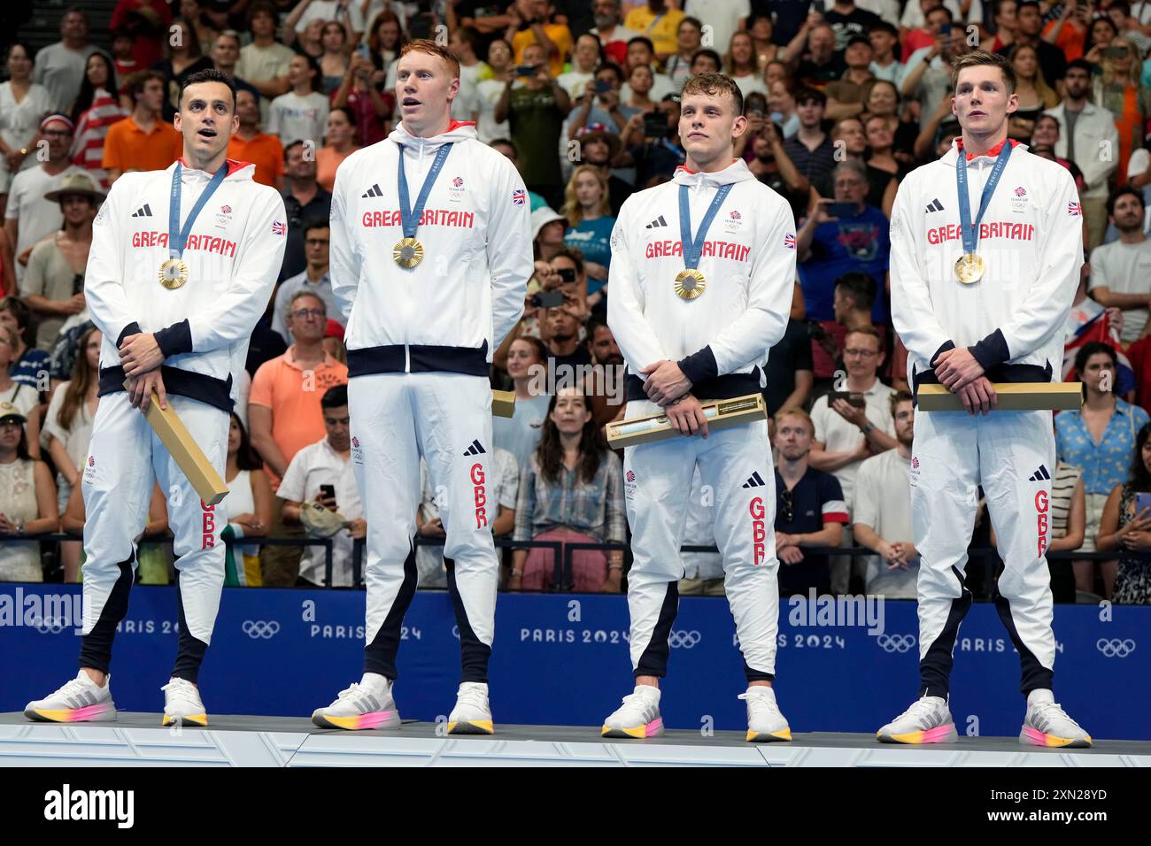 Britain's men's 4x200-meter freestyle relay team stand on the podium ...