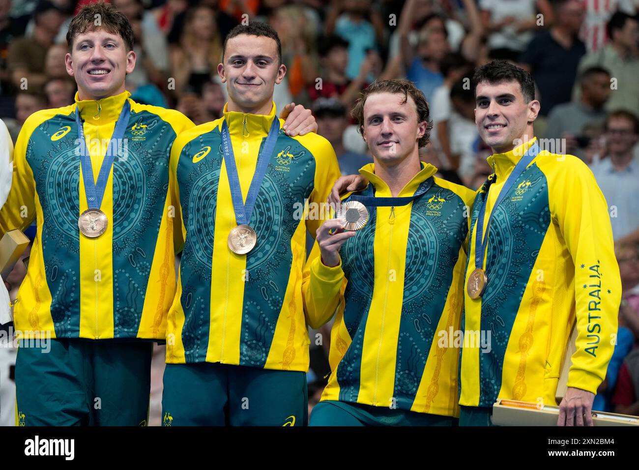 Australia's men's 4x200-meter freestyle relay team pose with their bronze medals on the podium ...