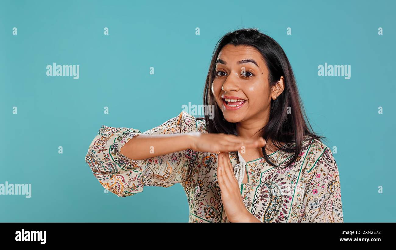 Portrait of assertive indian woman asking for timeout, doing hand ...
