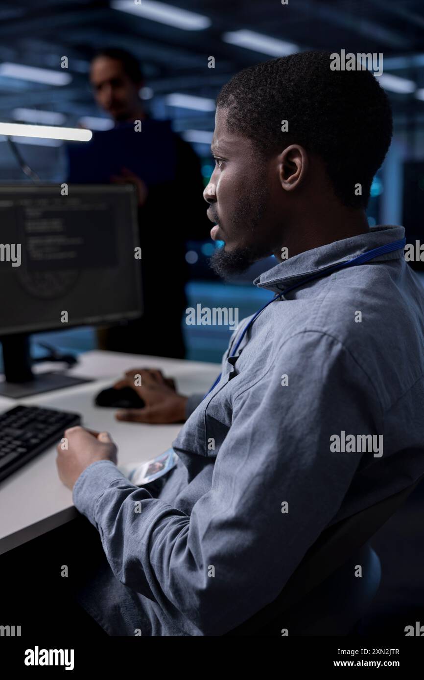 Engineer fixing vulnerabilities in software hi-res stock photography ...