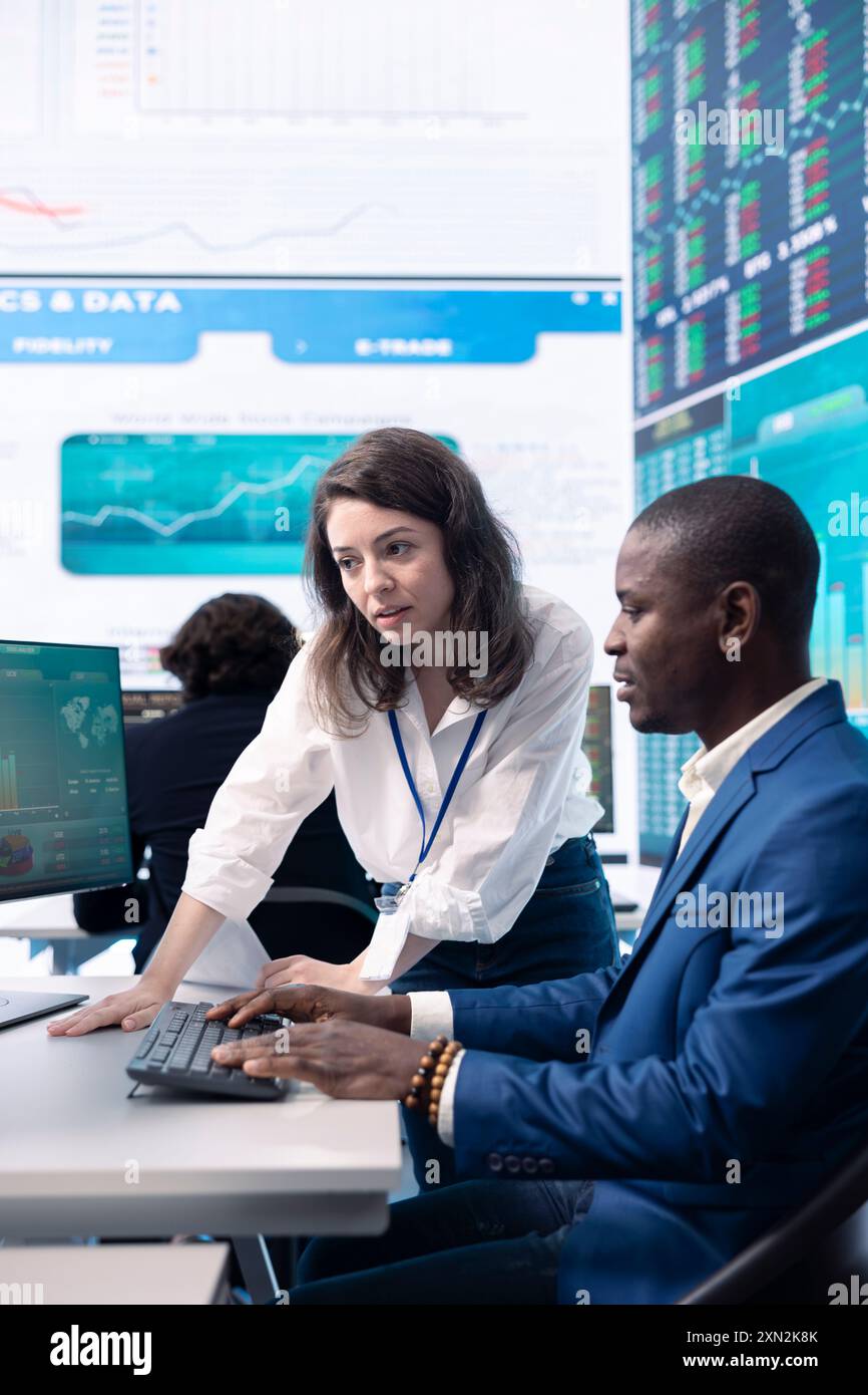 Enterprise colleagues reviewing project updates and details in ...