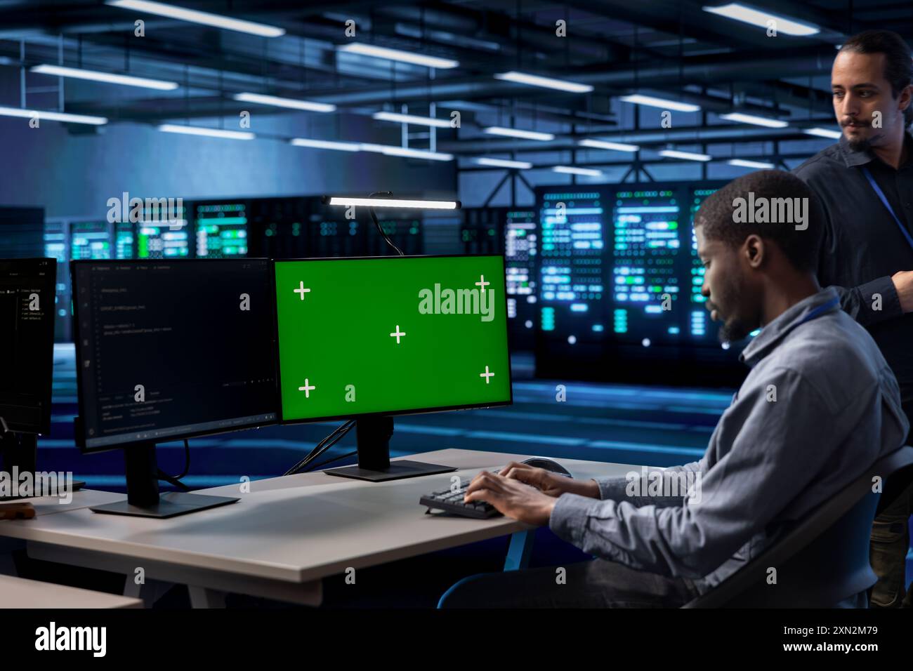 Engineer In Server Hub Using Green Screen Computer To Find Firewall