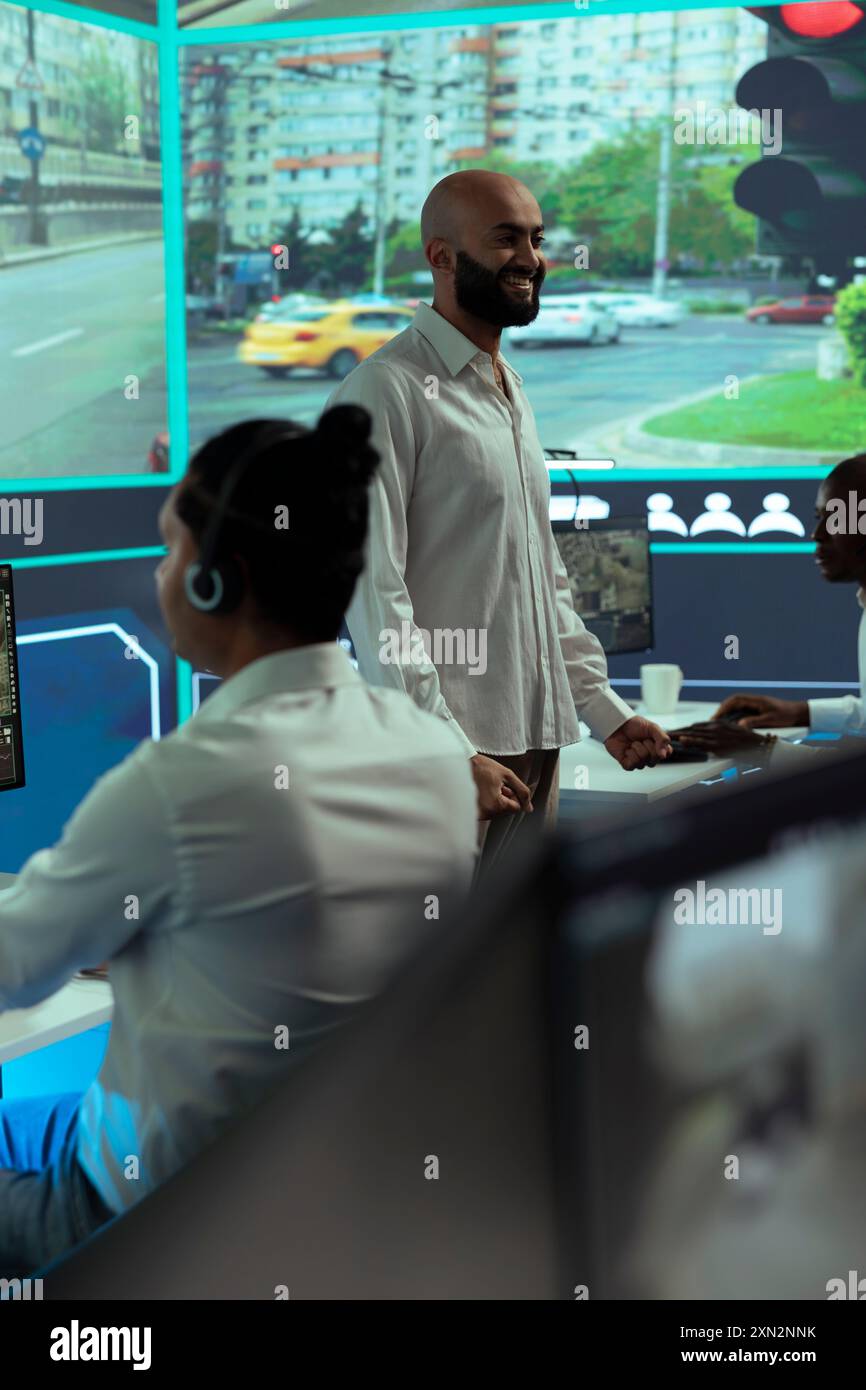 Middle eastern man oversees traffic monitoring activity in the office ...
